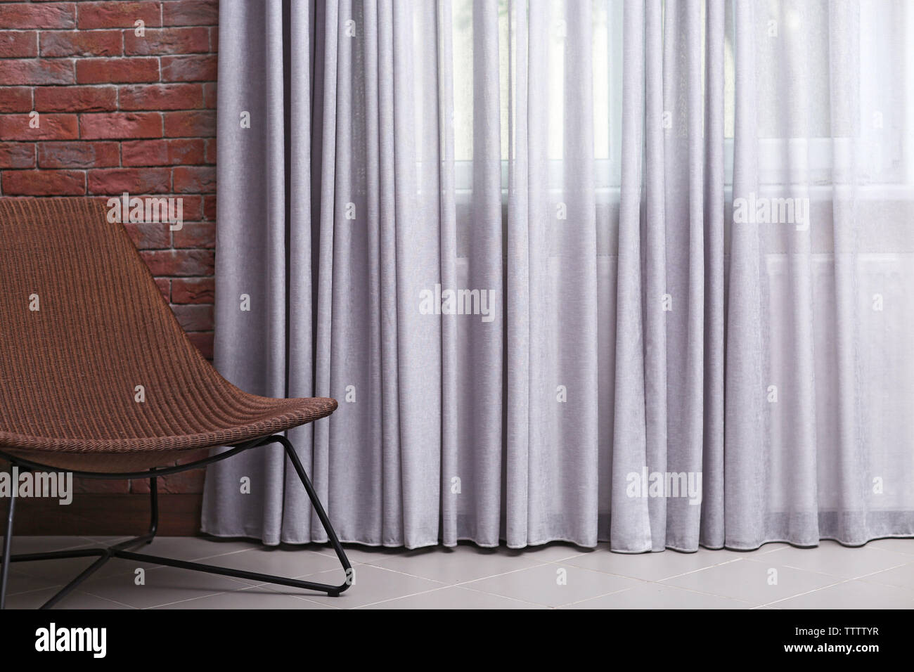 Chair and room window with grey curtains Stock Photo - Alamy