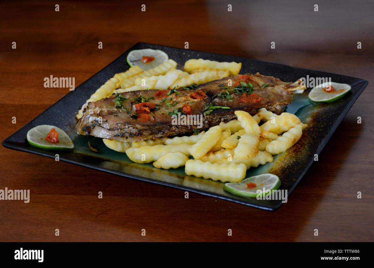 Beautiful Piece of Fried Fish with French Fries and Cilantro Stock ...