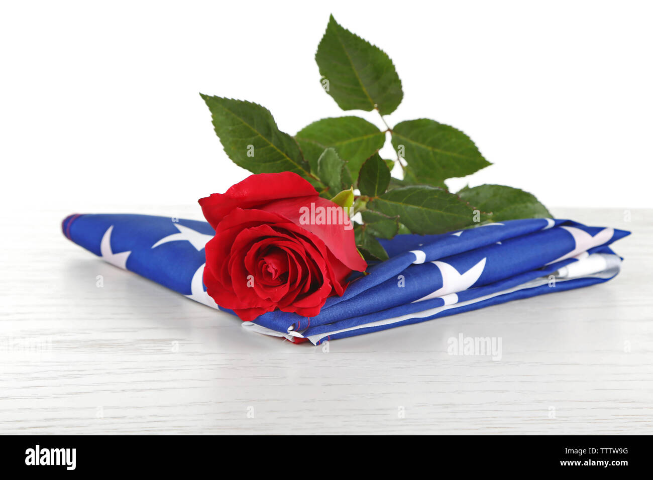 Red rose on American flag, isolated on white Stock Photo - Alamy