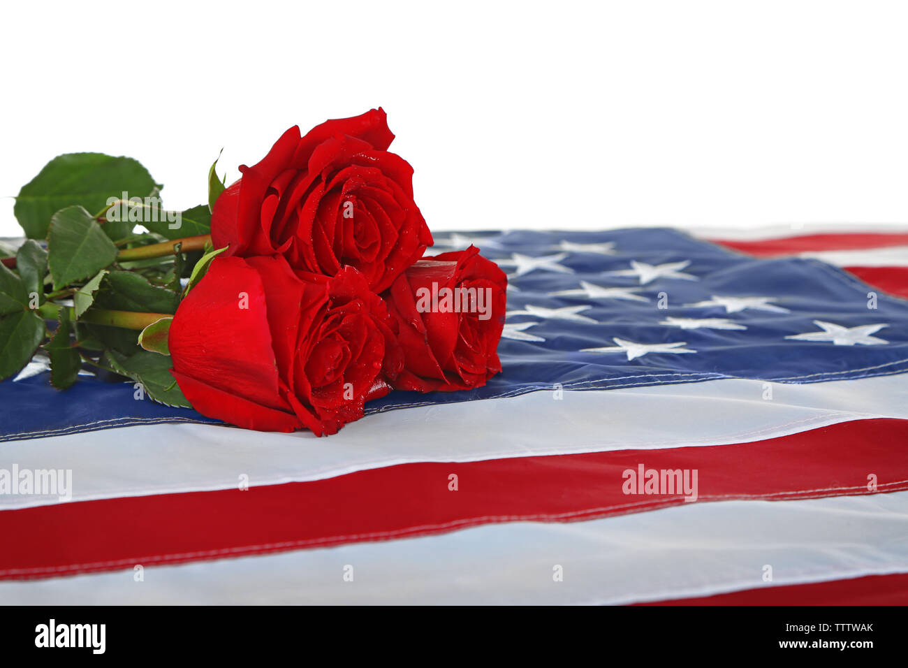 Red roses on American flag, closeup Stock Photo - Alamy