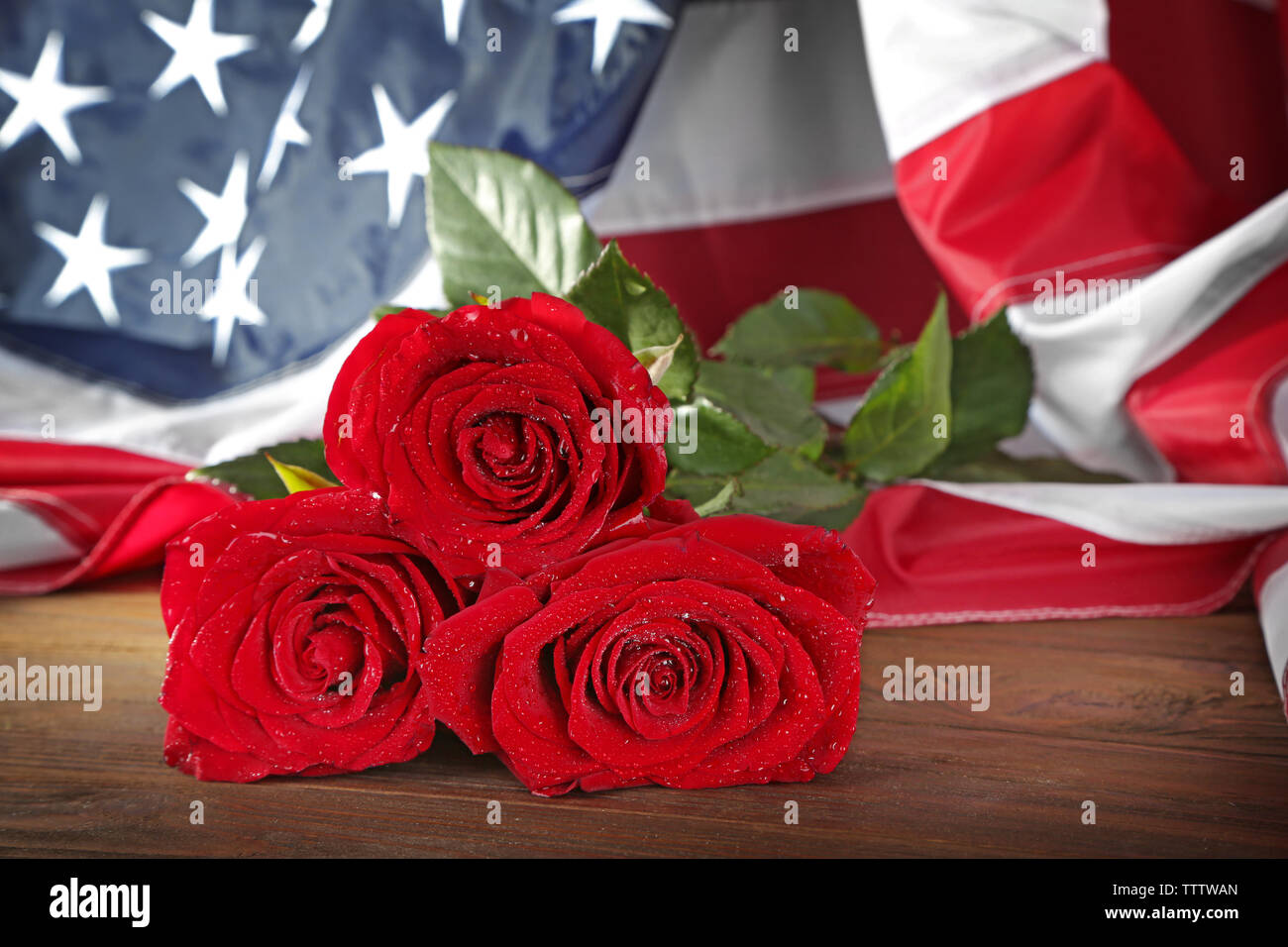 Red roses and American flag, closeup Stock Photo - Alamy