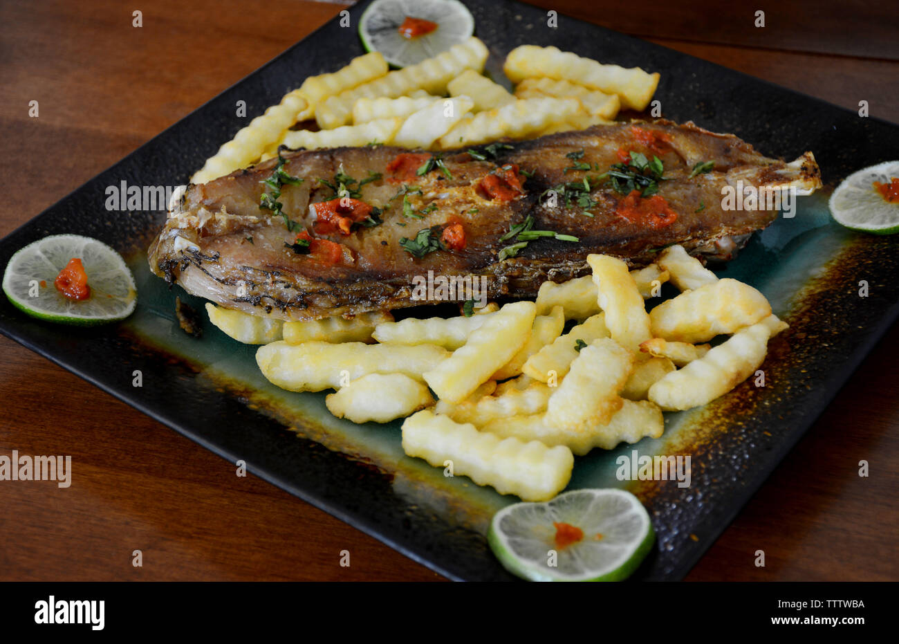 Beautiful Piece of Fried Fish with French Fries and Cilantro Stock ...