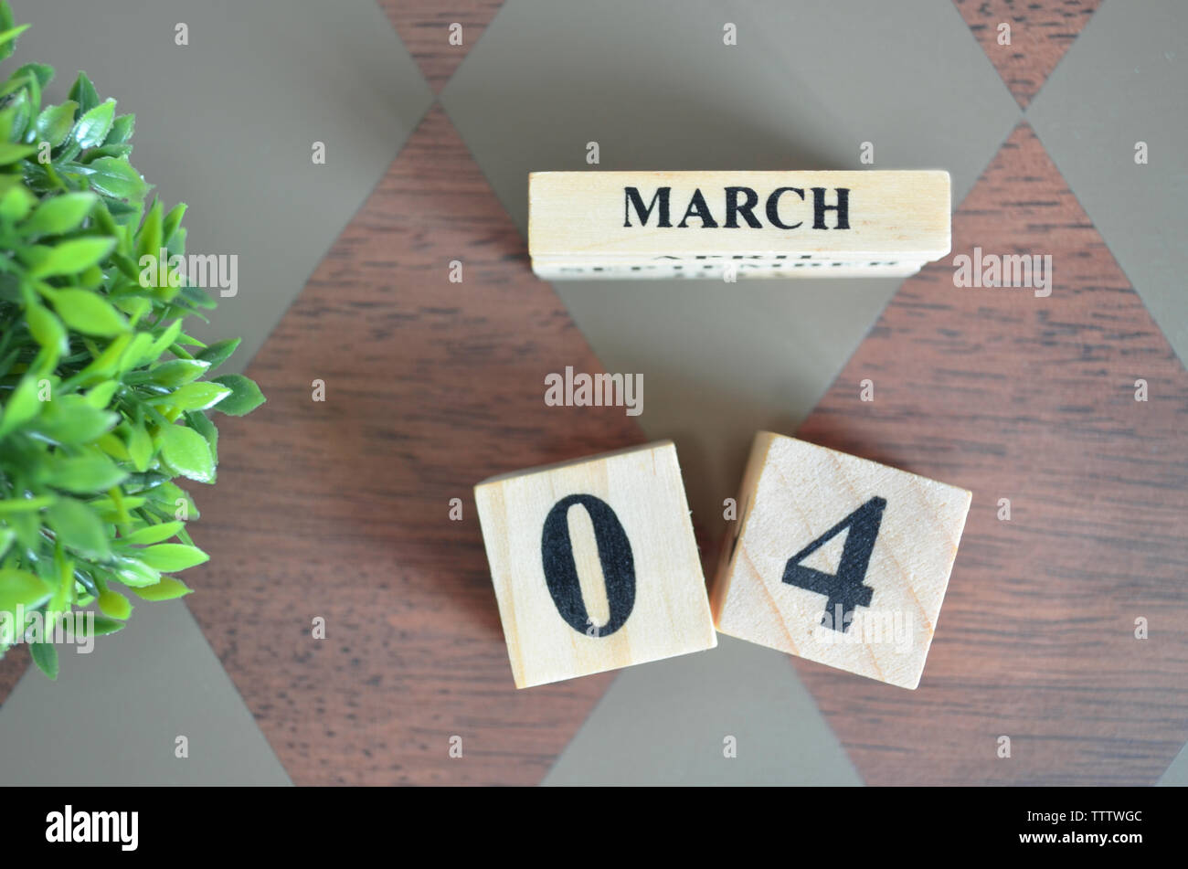 Date of March with leaf on diamond pattern table for background Stock ...