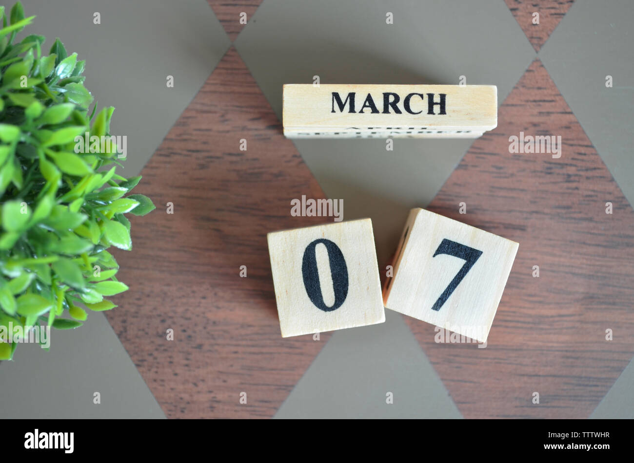 Date of March with leaf on diamond pattern table for background Stock ...