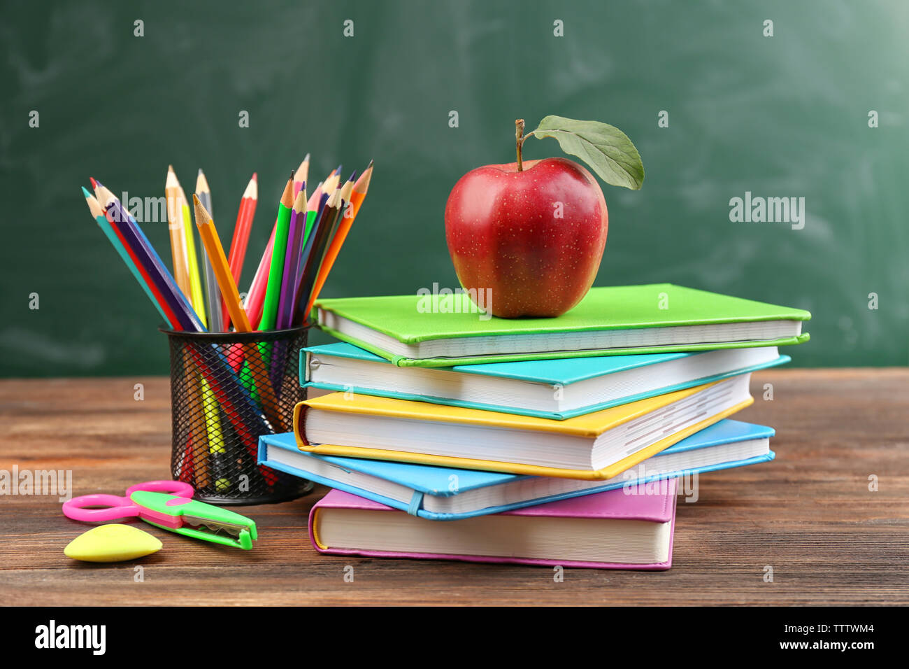 Apple with books and accessories. Back to school concept Stock Photo ...