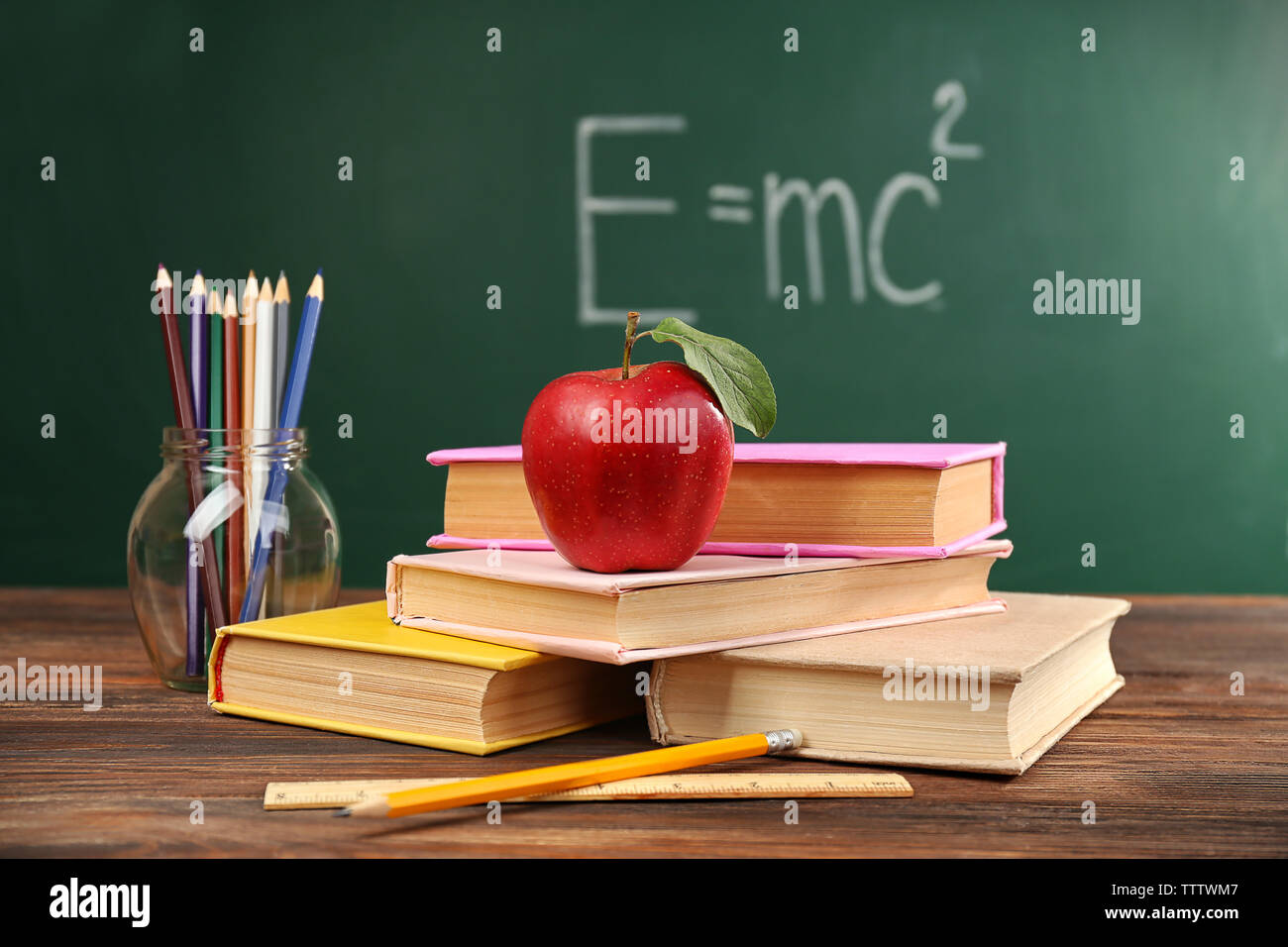 Apple with books and accessories. Back to school concept Stock Photo ...