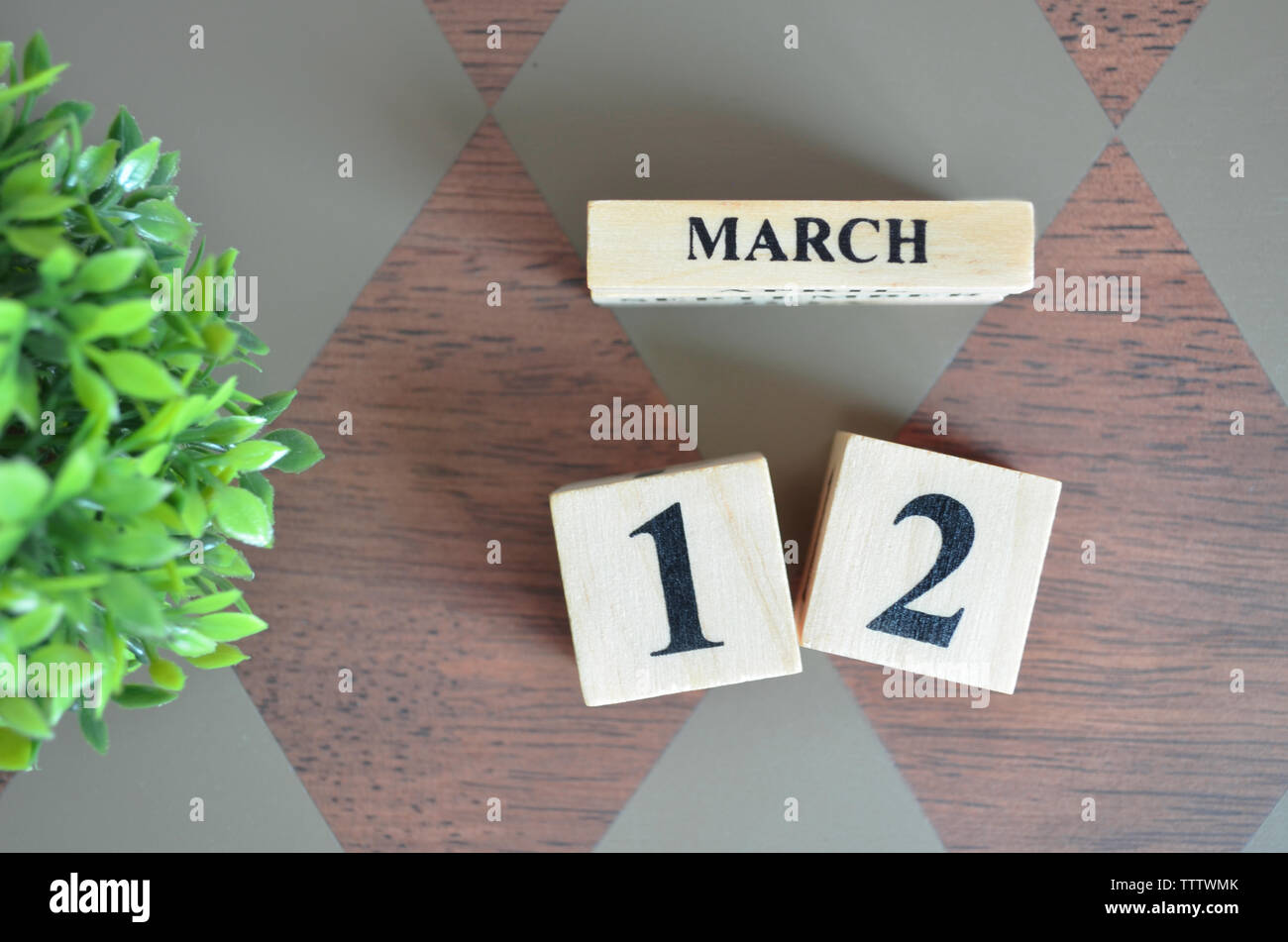 Date of March with leaf on diamond pattern table for background Stock ...