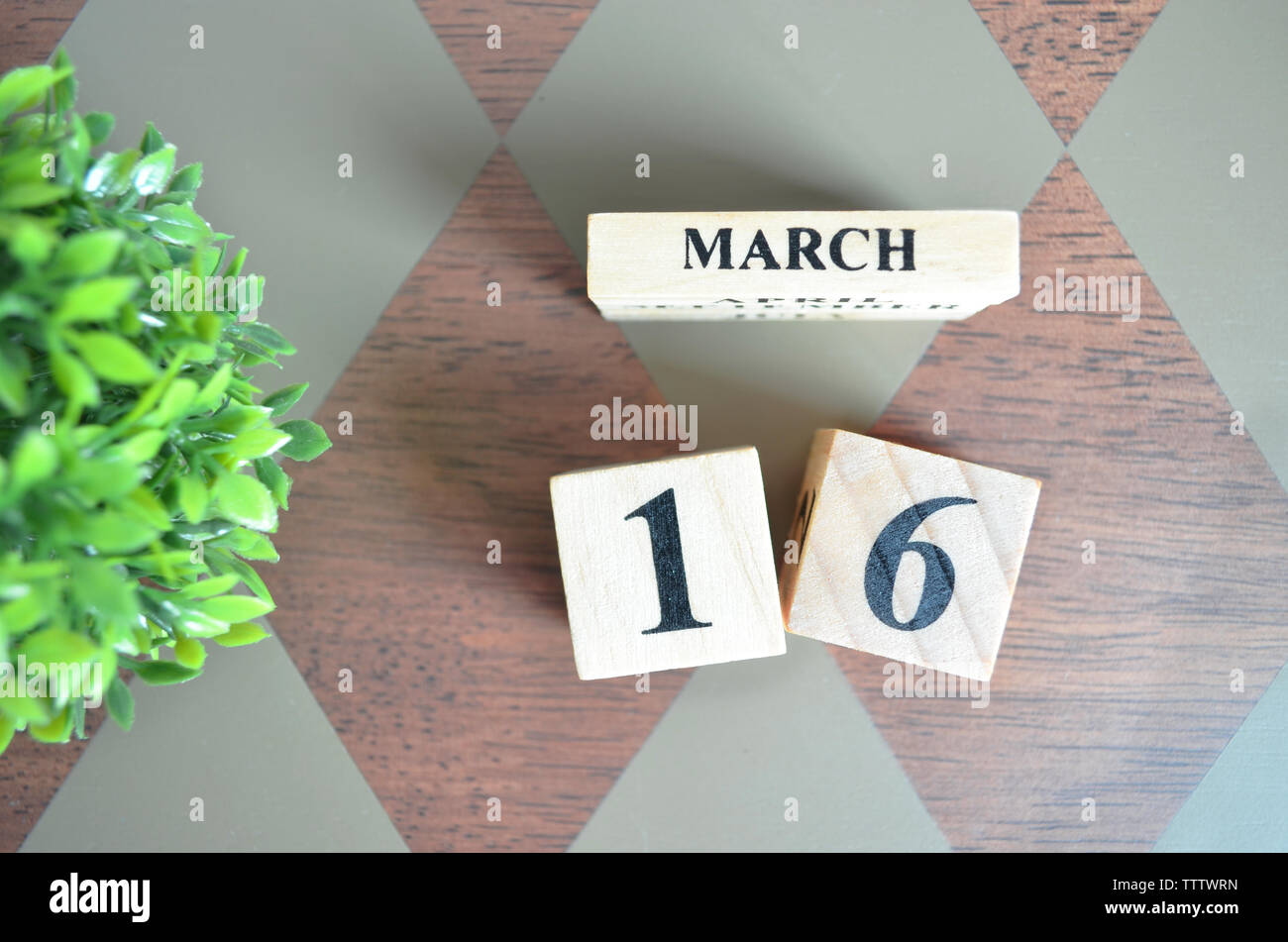 Date of March with leaf on diamond pattern table for background Stock ...