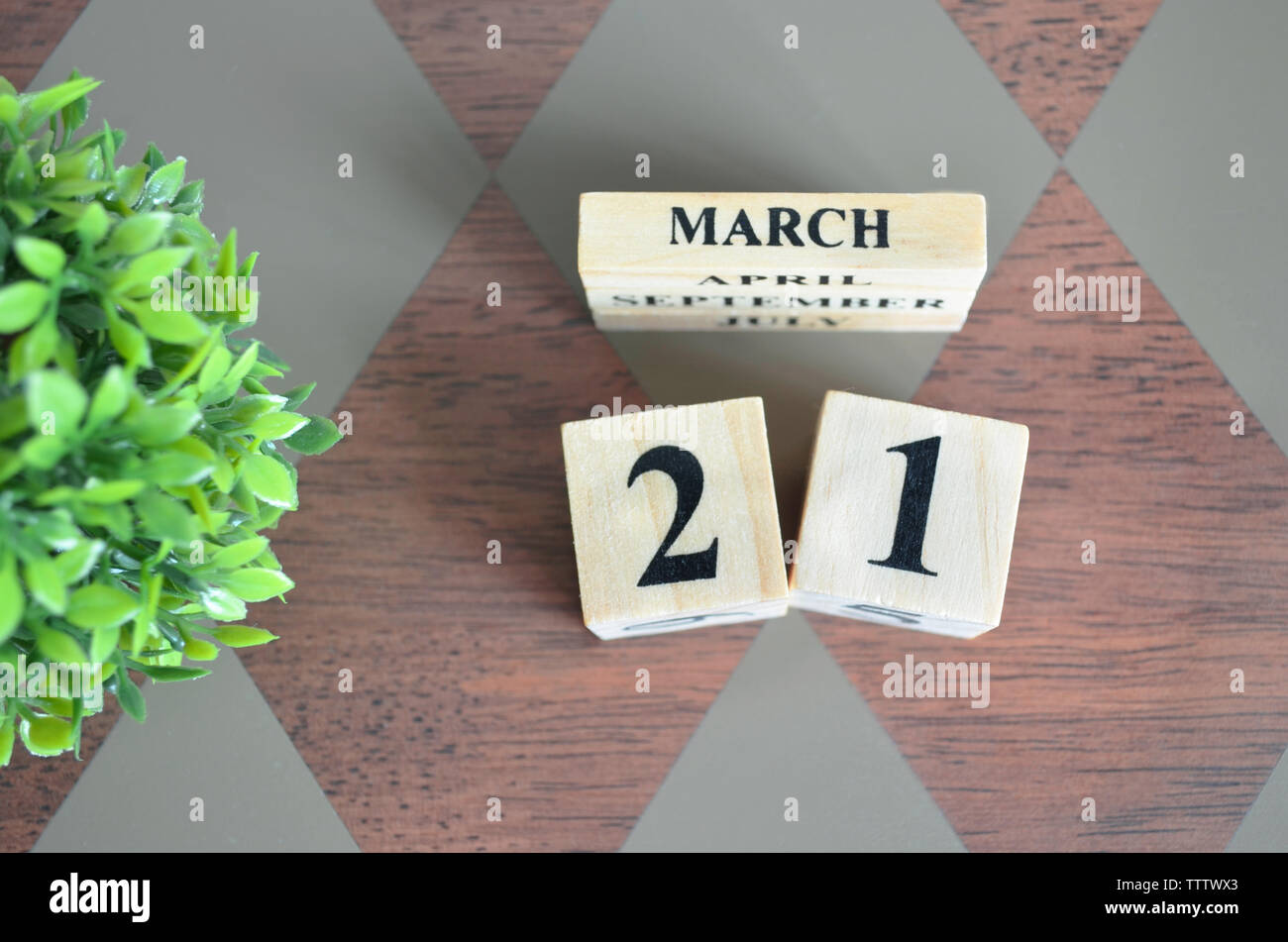 Date of March with leaf on diamond pattern table for background Stock ...
