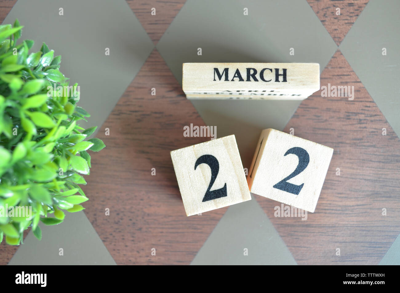 Date of March with leaf on diamond pattern table for background Stock ...