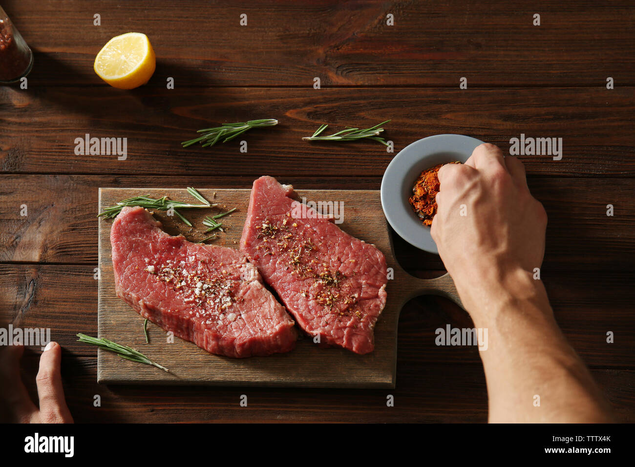 Butcher cooking pork meat on kitchen Stock Photo - Alamy