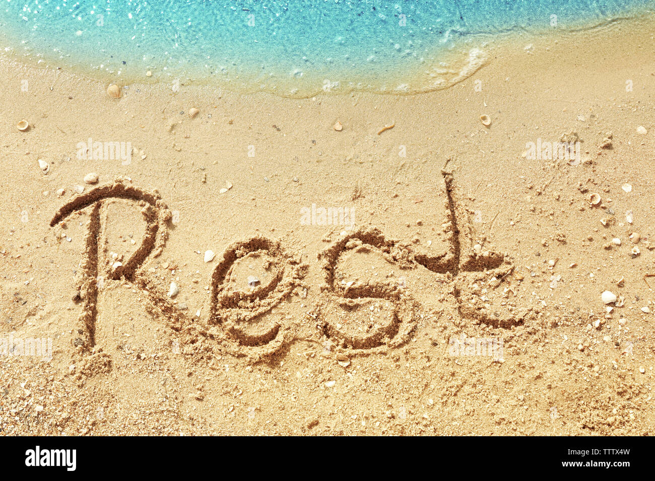 Word REST on beach sand Stock Photo - Alamy
