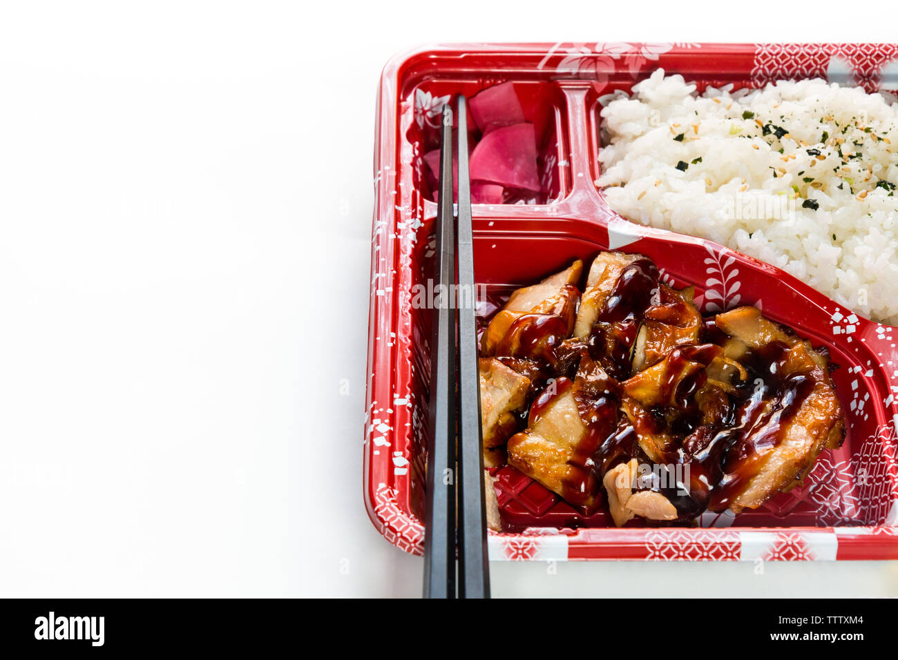 Japan Food of Grilled chicken (teriyaki) rice in a box on white ...