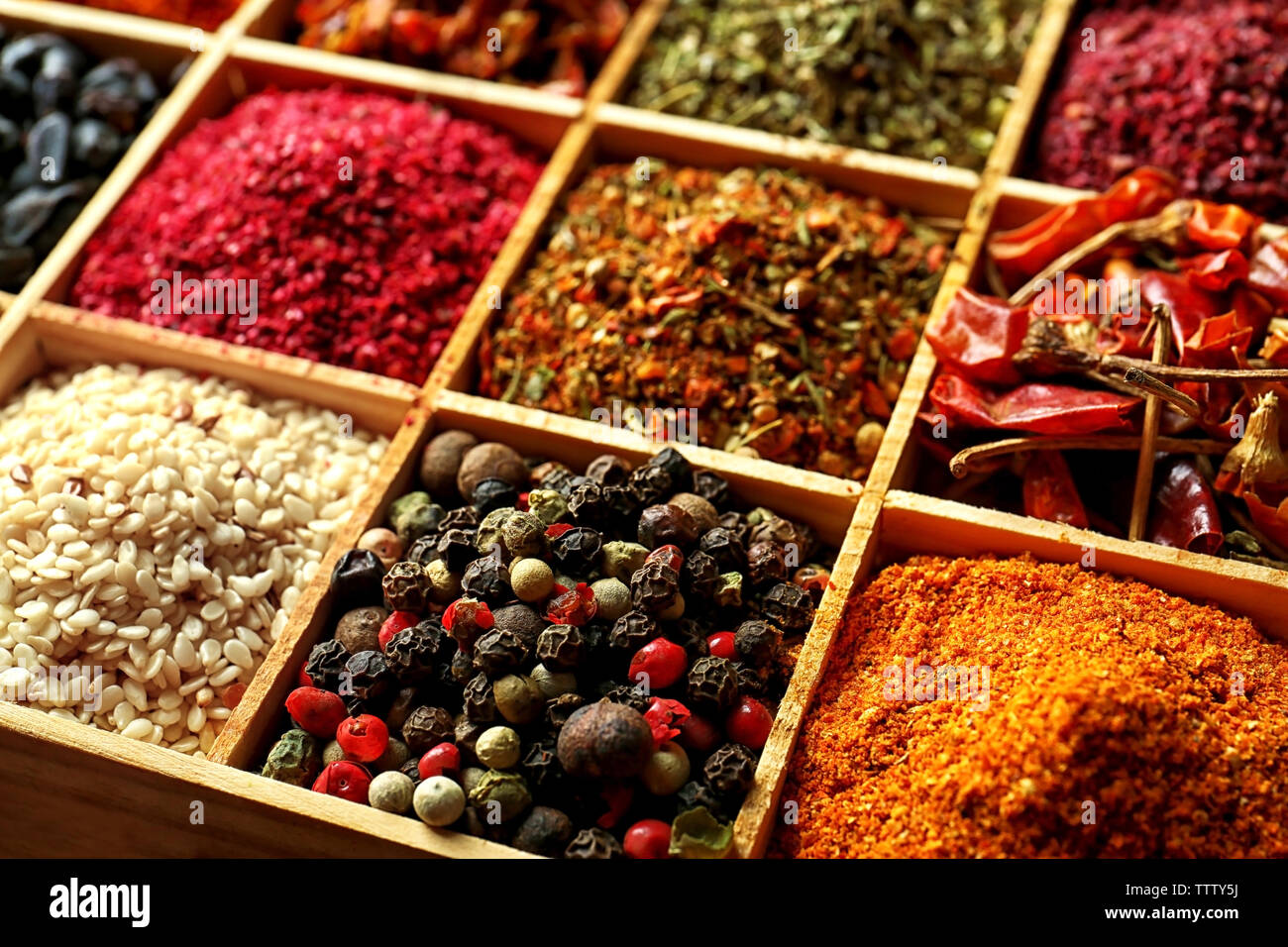 Different spices in wooden cells, closeup Stock Photo - Alamy