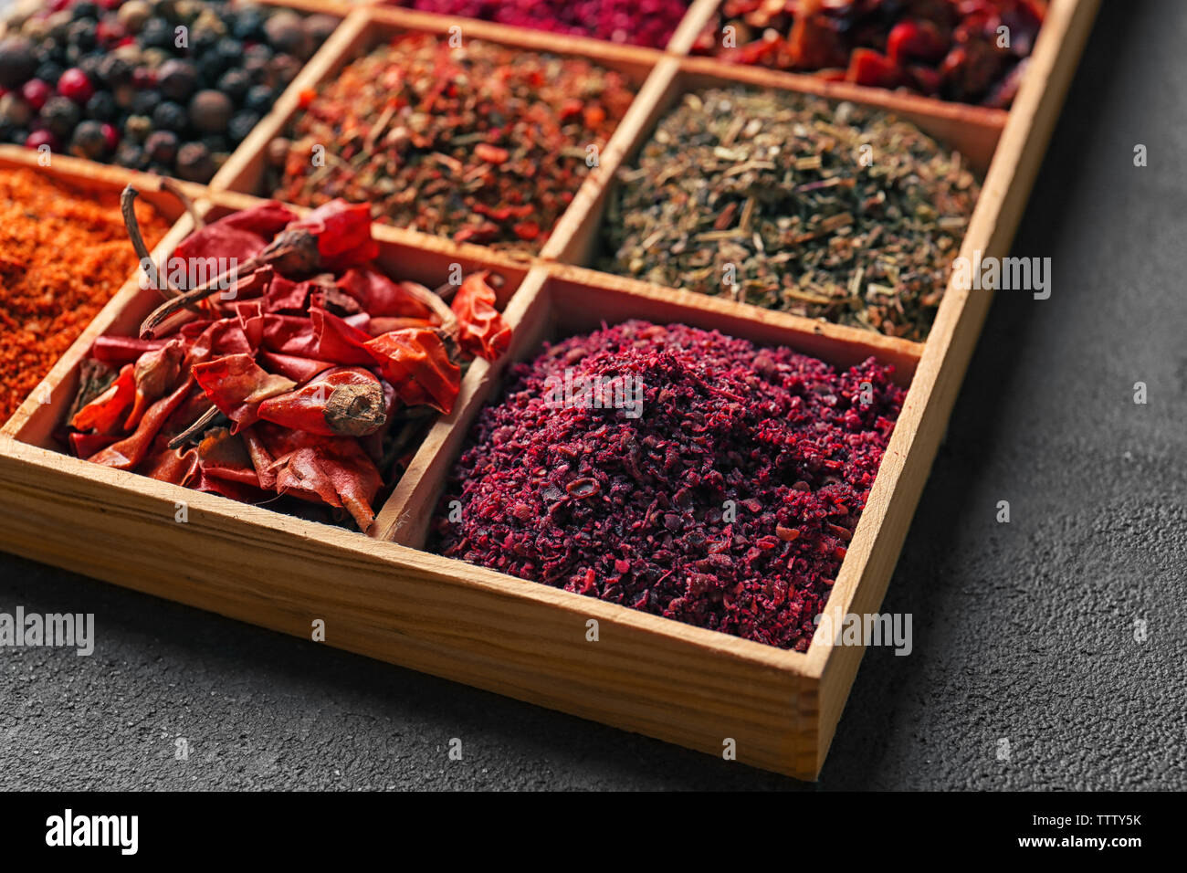 Different spices in wooden cells, closeup Stock Photo - Alamy