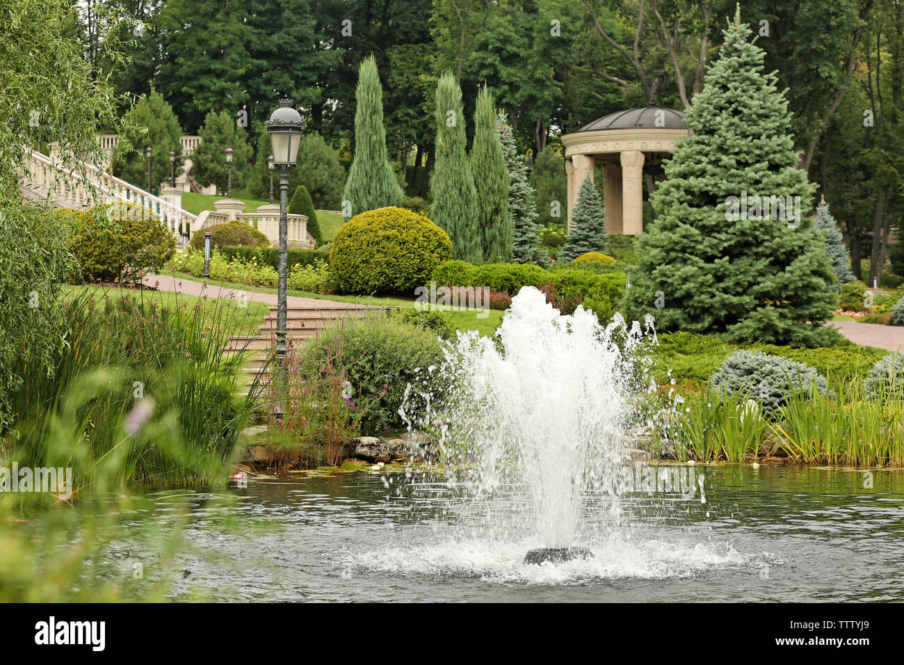 Beautiful park with pond and fountain Stock Photo - Alamy