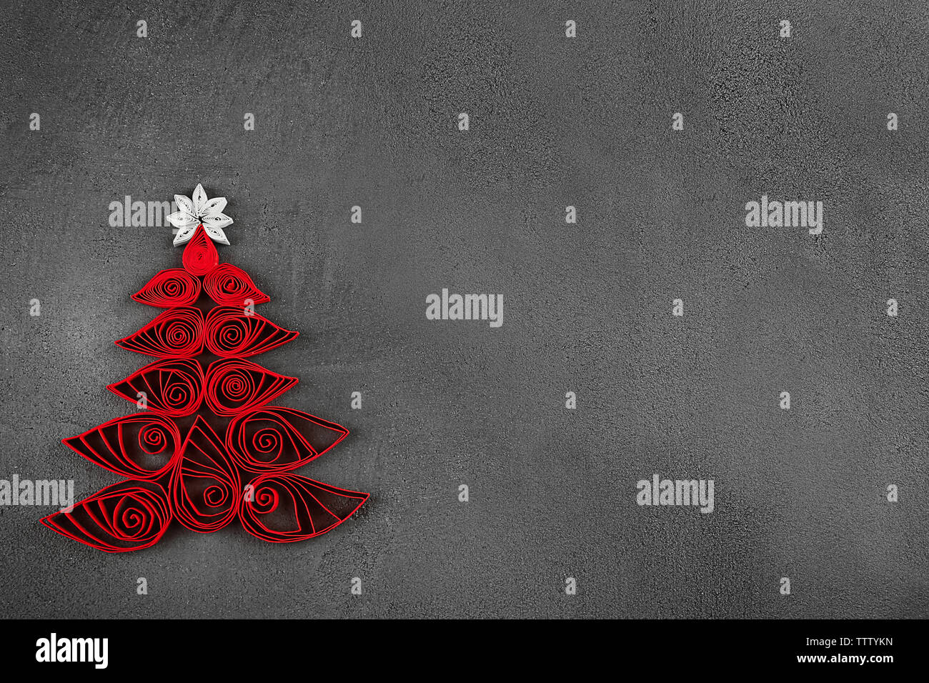 Christmas paper tree on grey background Stock Photo - Alamy