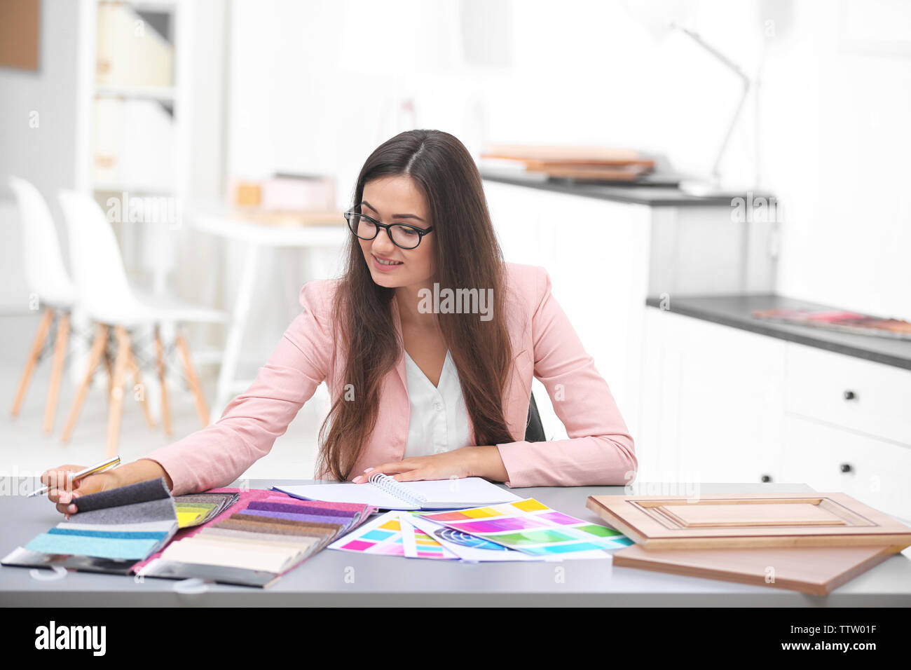 Beautiful female designer working in modern office Stock Photo - Alamy