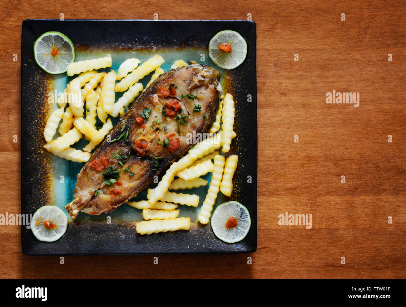 Beautiful Piece of Fried Fish with French Fries and Cilantro Stock ...