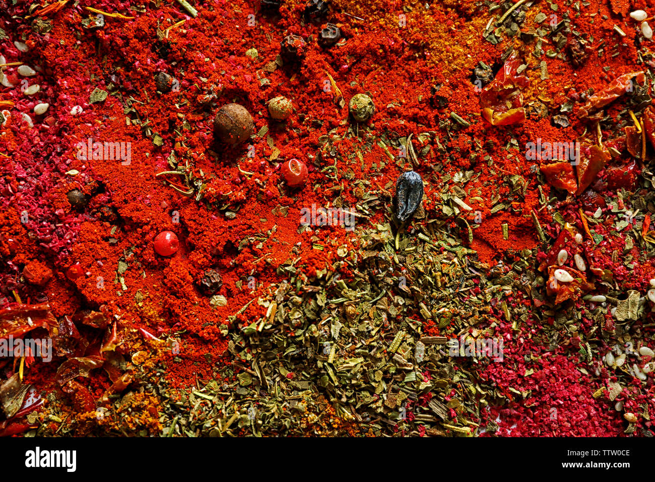 Mix of different flavored spices background Stock Photo - Alamy
