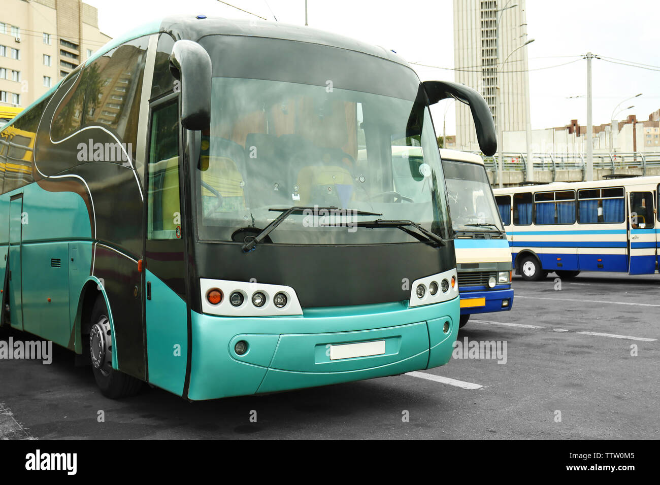 New tourist bus at station Stock Photo - Alamy