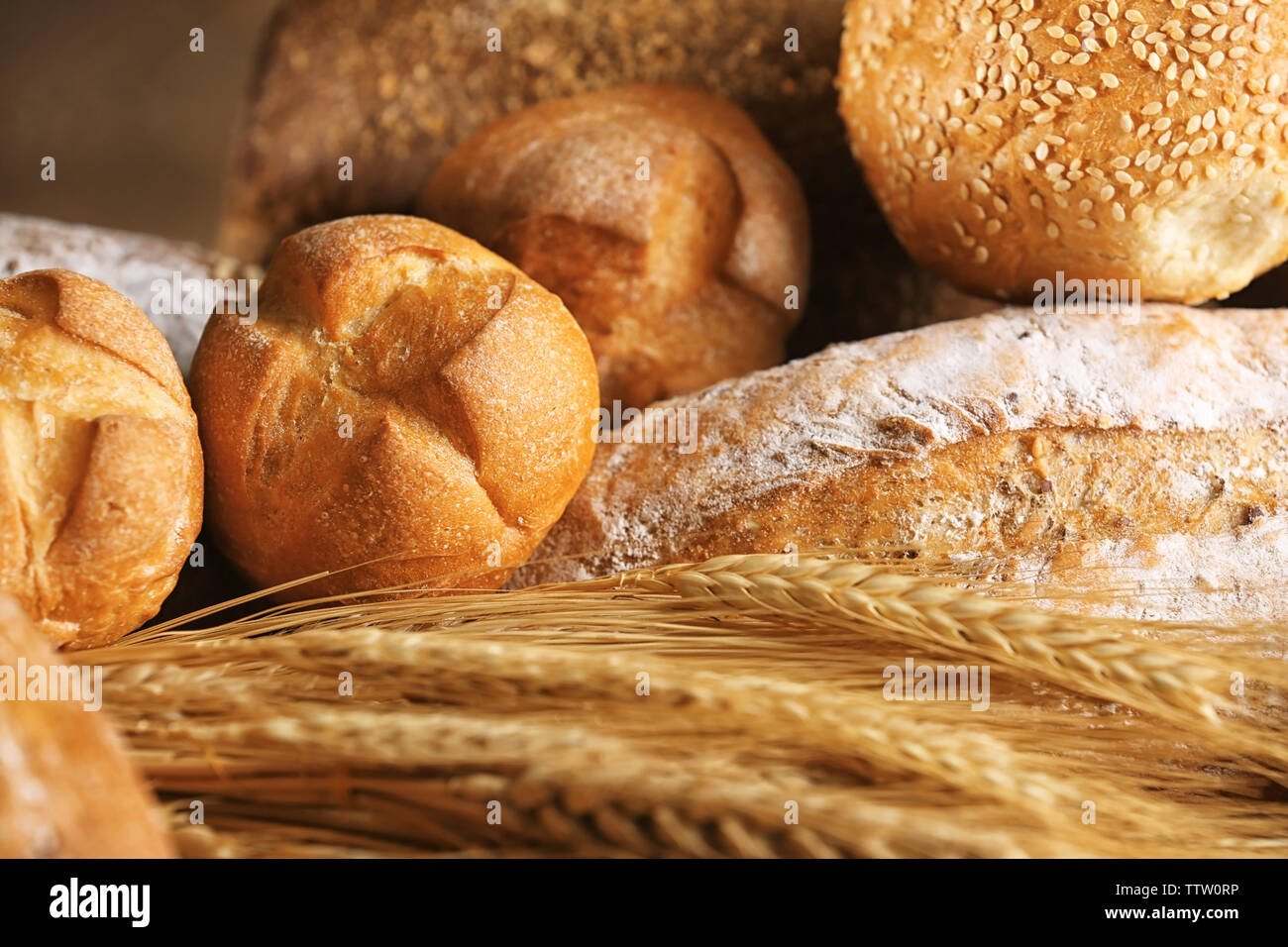 Variety of wheat bread and spikes, close up Stock Photo - Alamy