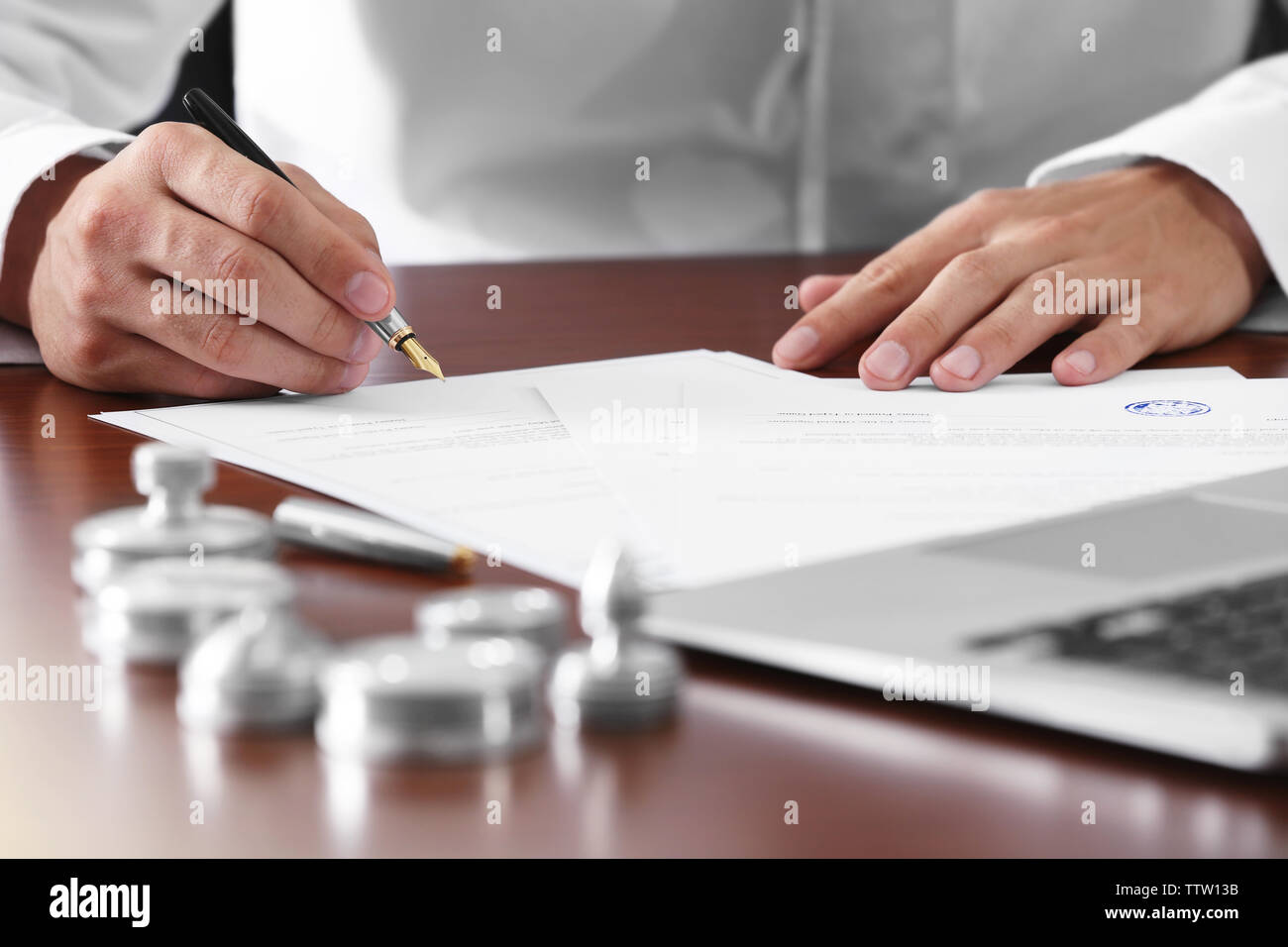 Notary public in office signing document Stock Photo - Alamy