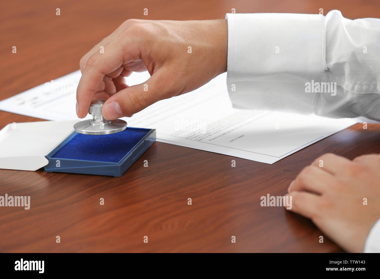 Pressing stamp hi-res stock photography and images - Alamy