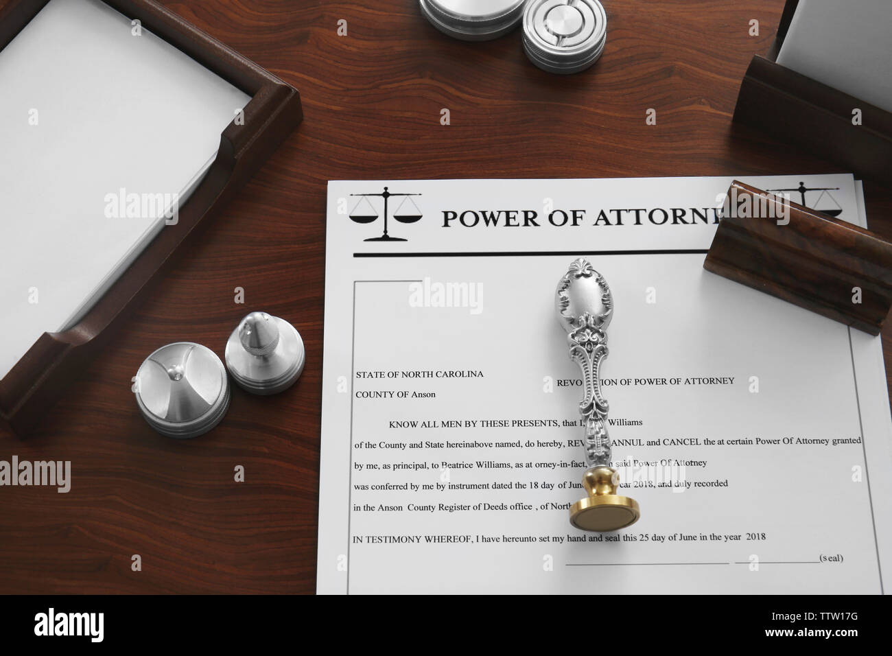 Pen, document, stamp and ink pads on notary public table Stock Photo ...