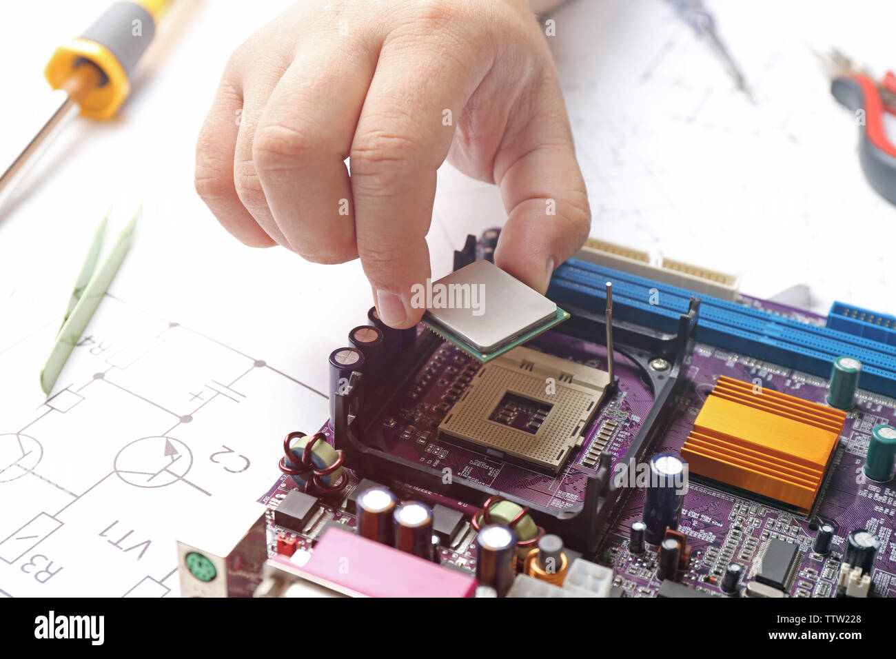 Man installing microprocessor on motherboard, close up Stock Photo - Alamy