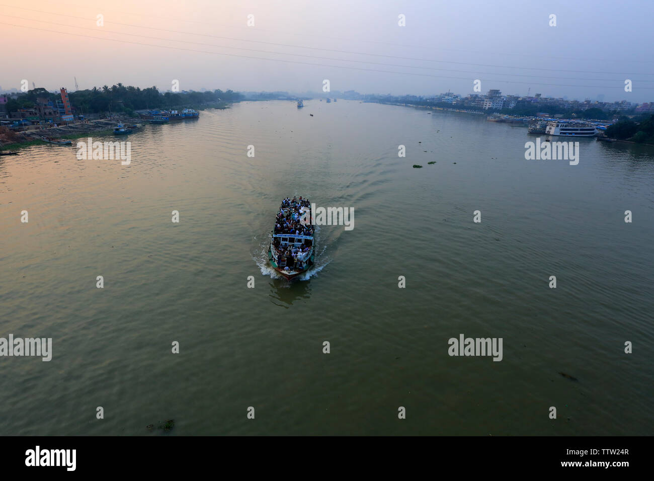 Desperate Eid holidaymakers mount the rooftop of launch to reach their ...