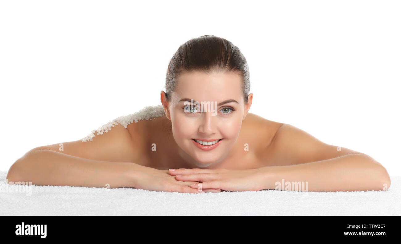 Young woman with scrub on back lying on white background Stock Photo ...