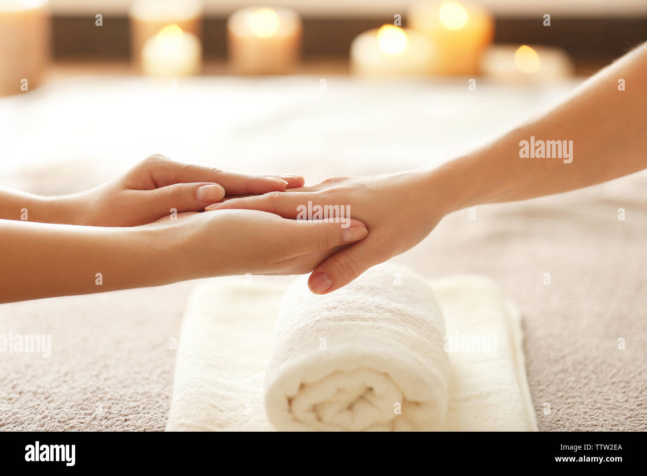 Spa concept. Specialist massaging female hand Stock Photo - Alamy
