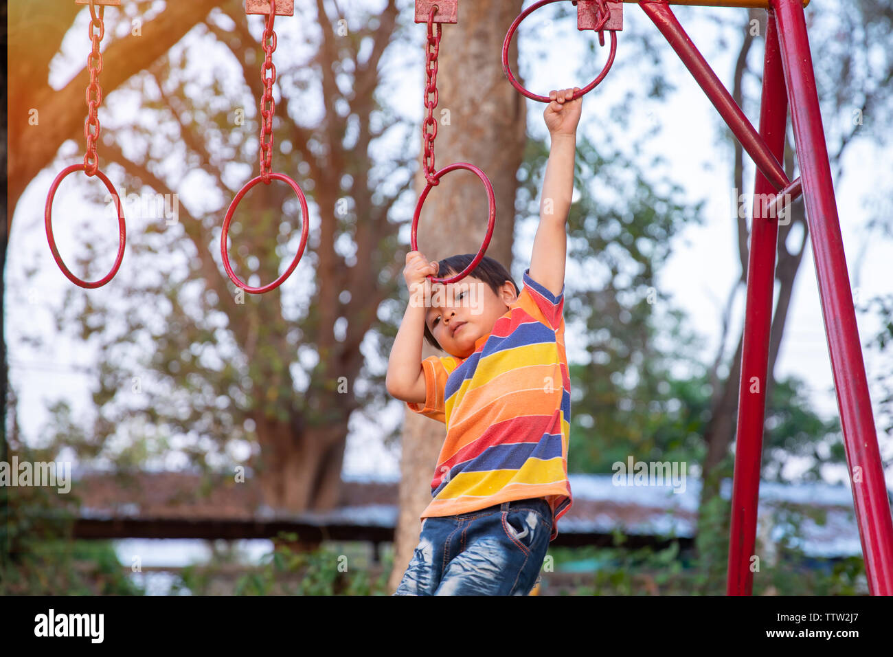 The boy is playing on the playground Stock Photo - Alamy