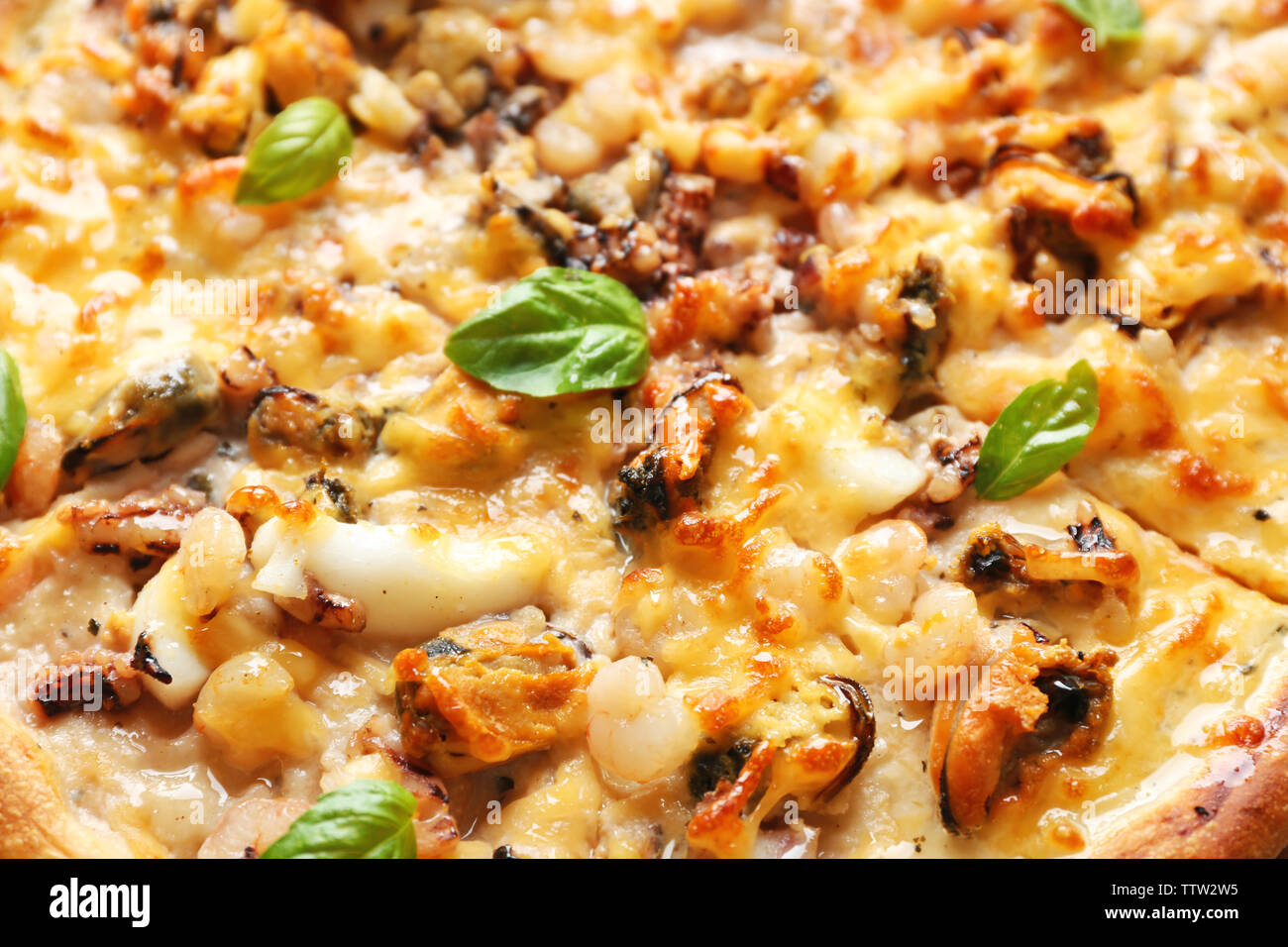 Delicious seafood pizza background Stock Photo - Alamy