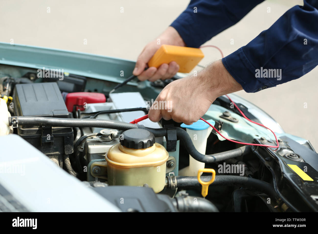 Man hands inspecting car engine hi-res stock photography and images - Alamy