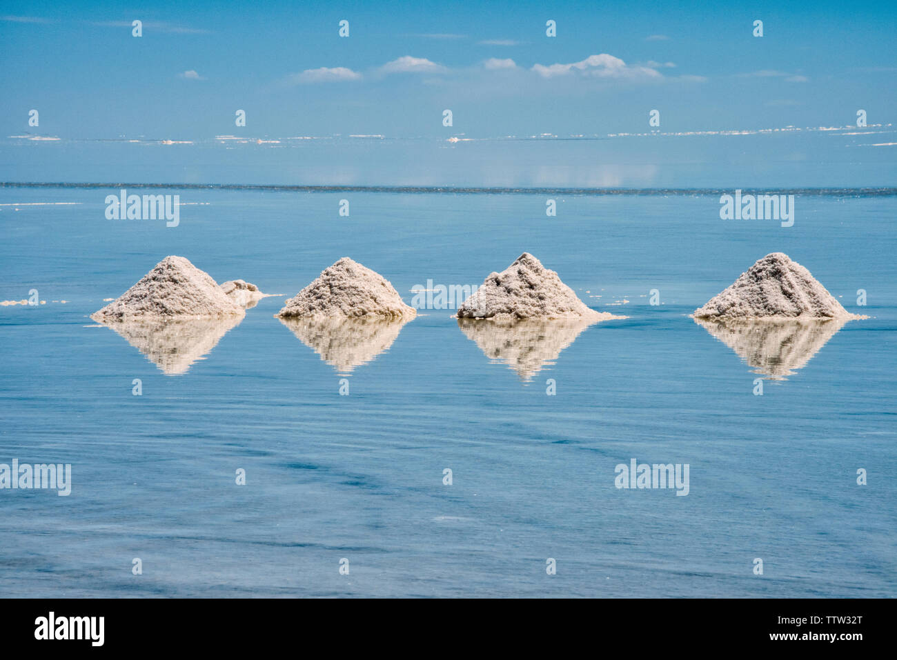 Salt cones on the reflected surface of the salt flat, Salar de Uyuni ...