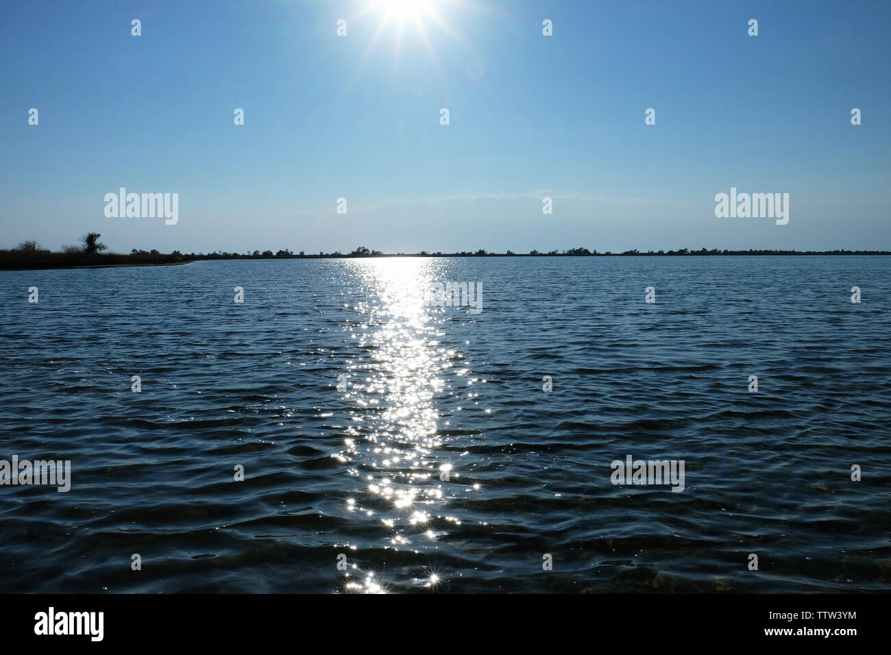 Sun reflection on water Stock Photo - Alamy