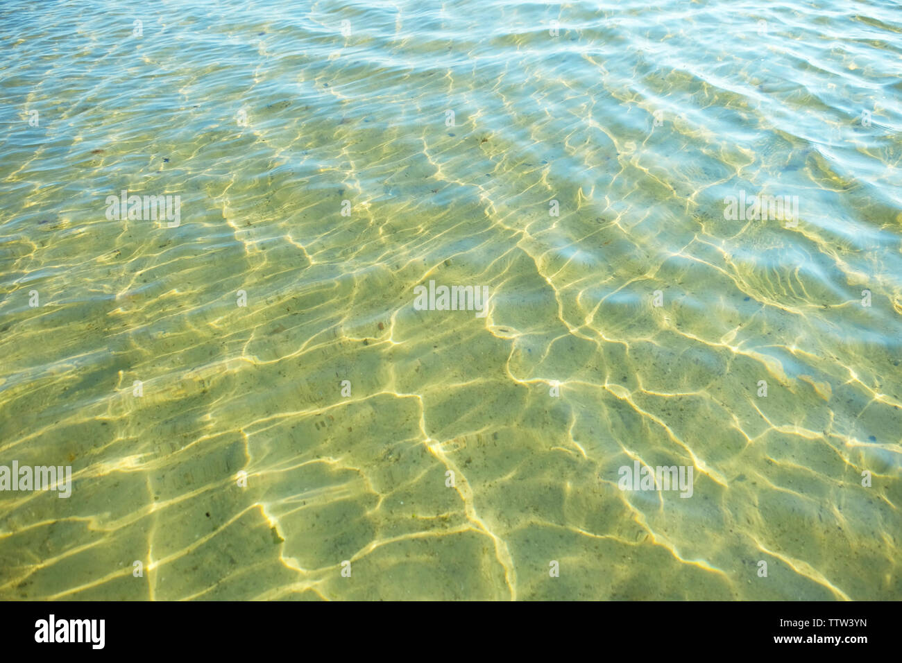 Sun reflection on water Stock Photo - Alamy