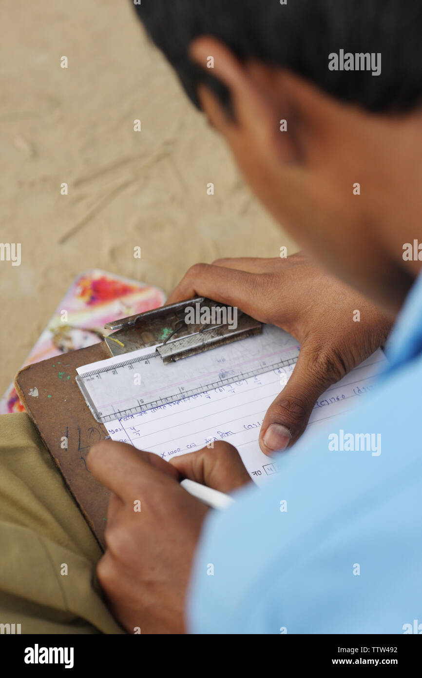 Boy taking exam at a school Stock Photo - Alamy