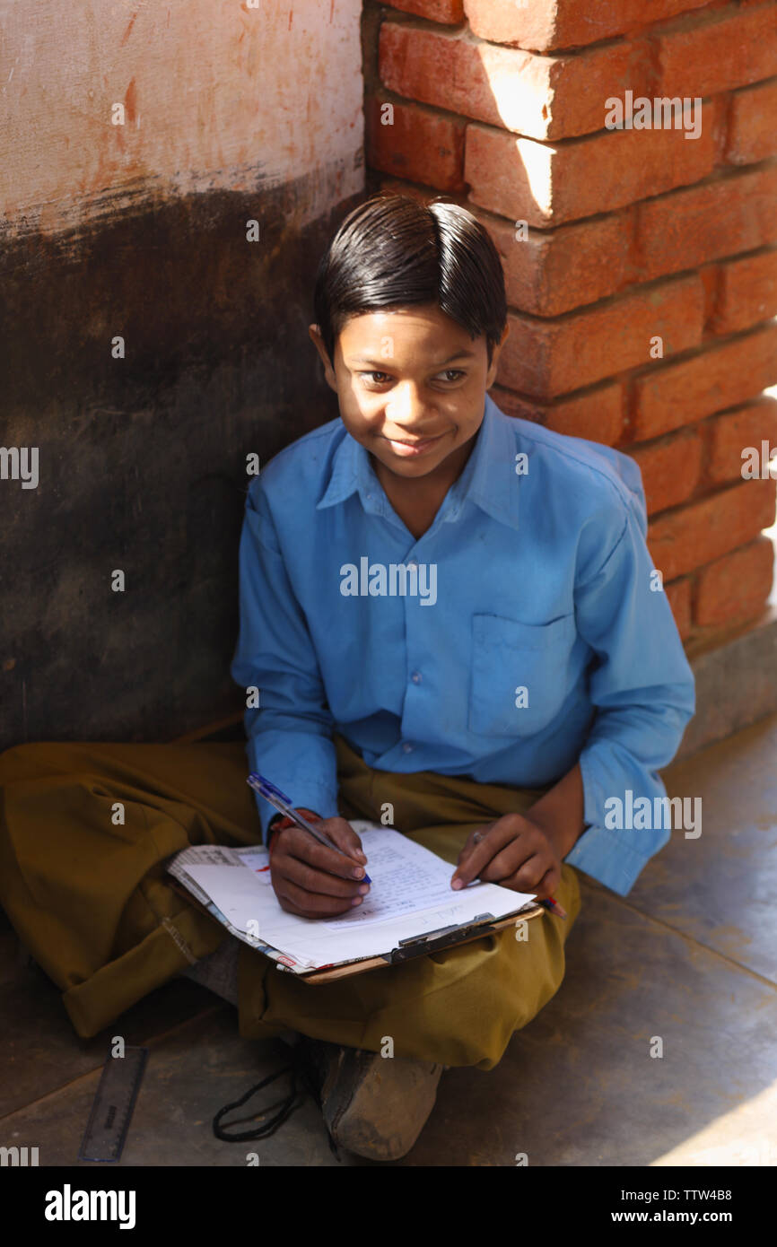 Boy taking exam at a school Stock Photo - Alamy