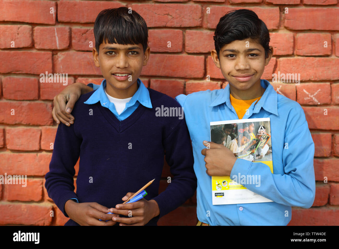 Two schoolboys standing together Stock Photo - Alamy