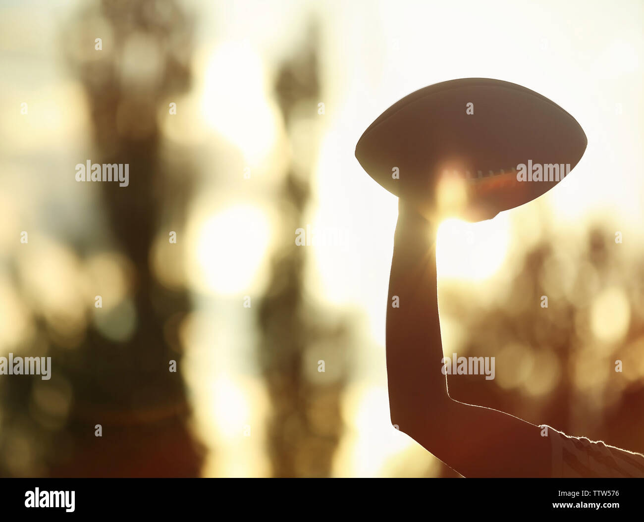 Rugby ball in hand hi-res stock photography and images - Alamy