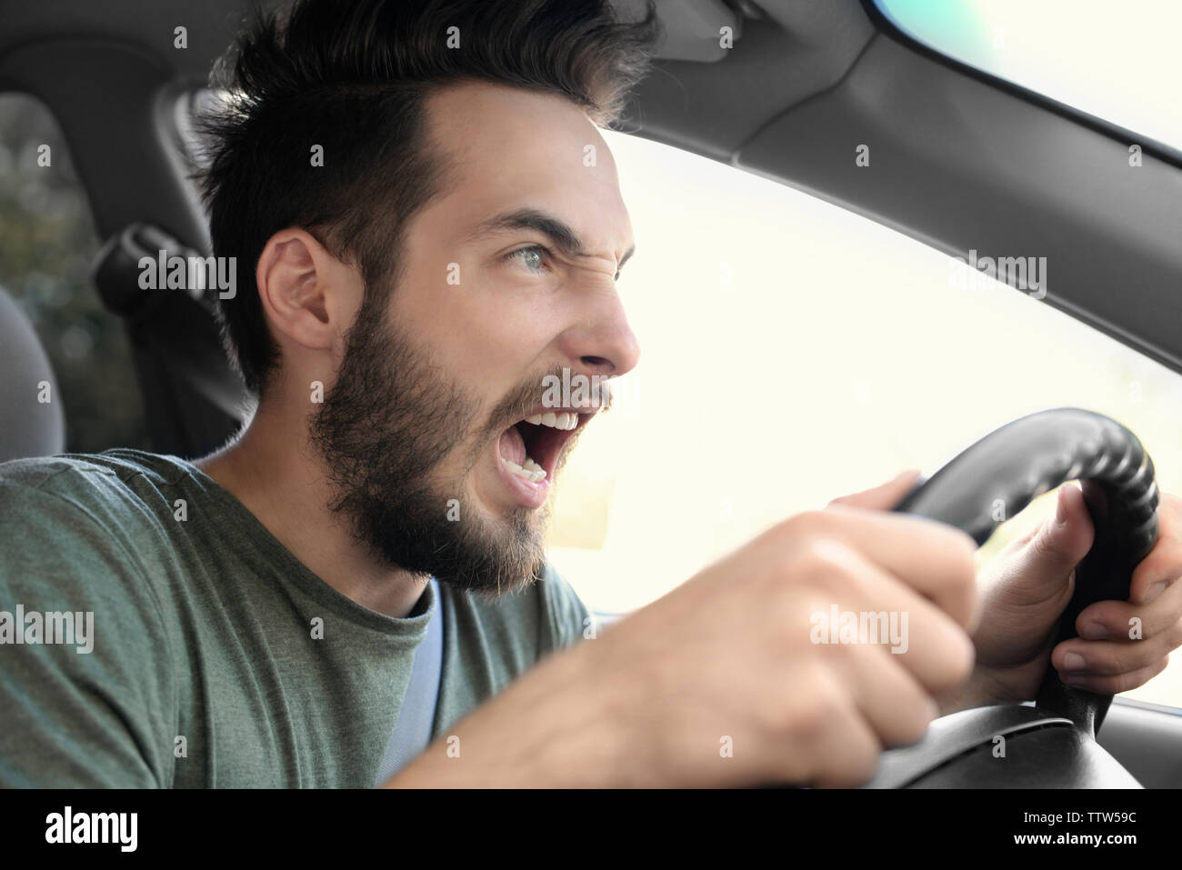 Portrait angry man driving car hi-res stock photography and images - Alamy
