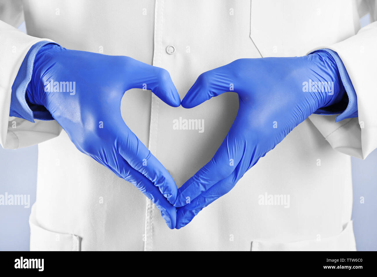 Male cardiologist making heart hi-res stock photography and images - Alamy