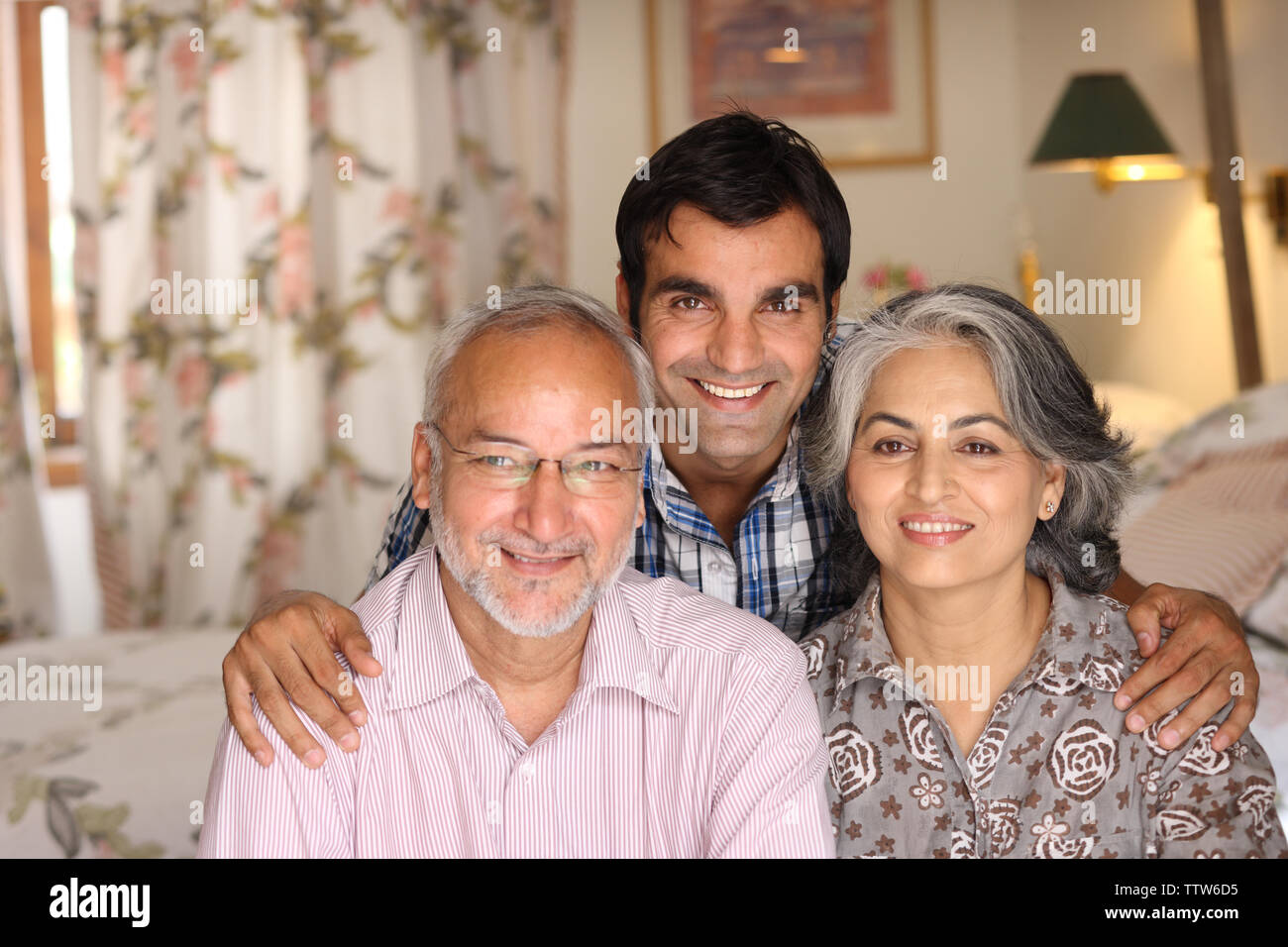 Portrait of a man with his parents Stock Photo - Alamy