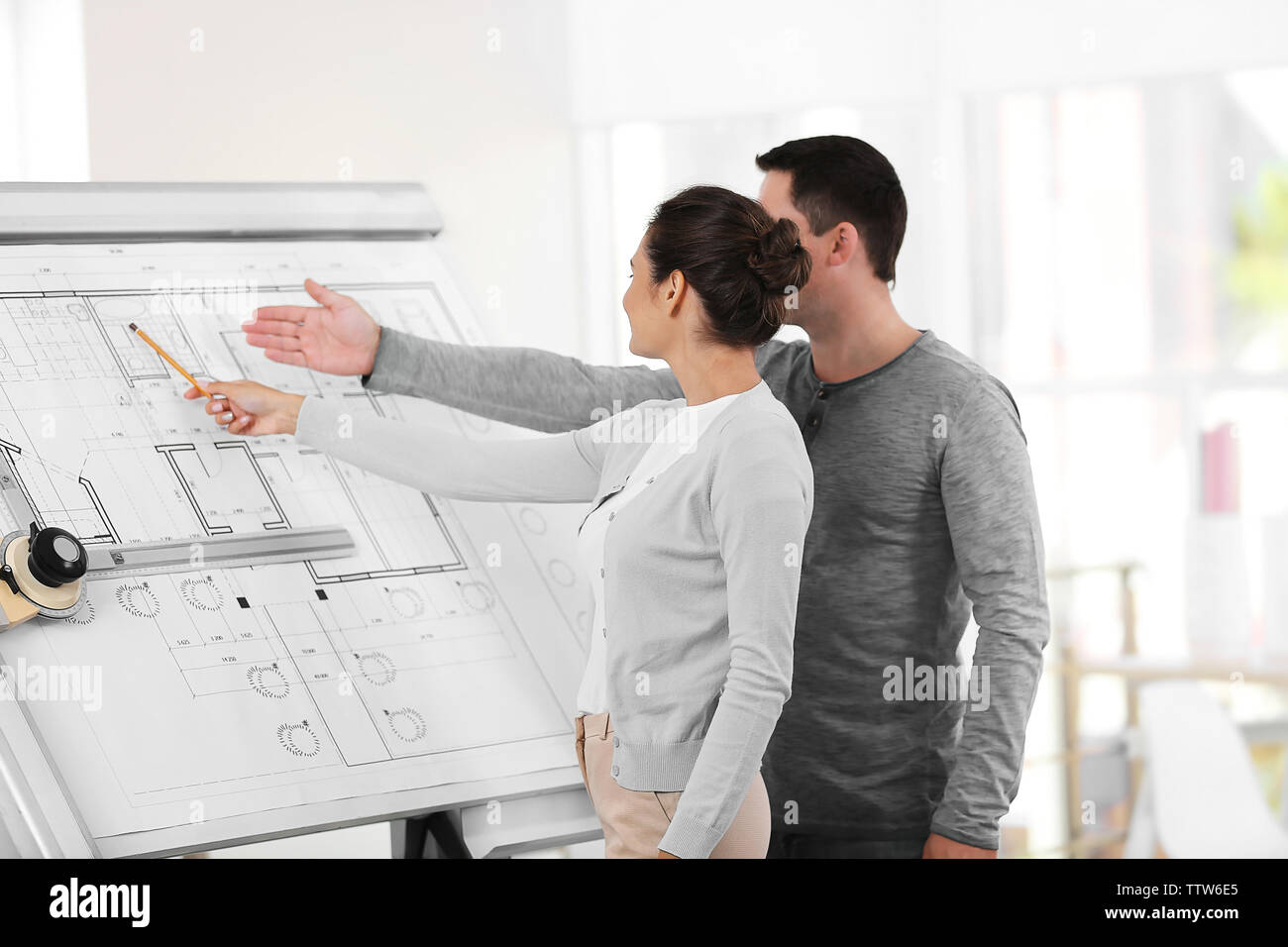 Team of young creative engineers working with new architectural project ...