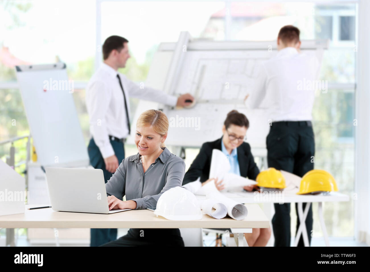 Group of creative engineers planning new project in office Stock Photo ...