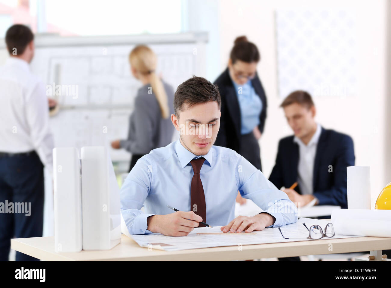 Group of creative engineers planning new project in office Stock Photo ...