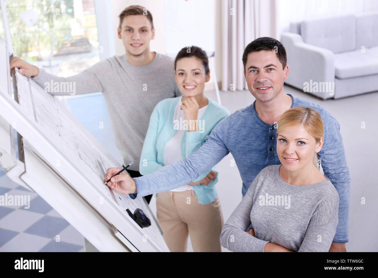 Team of young creative engineers working with new architectural project ...